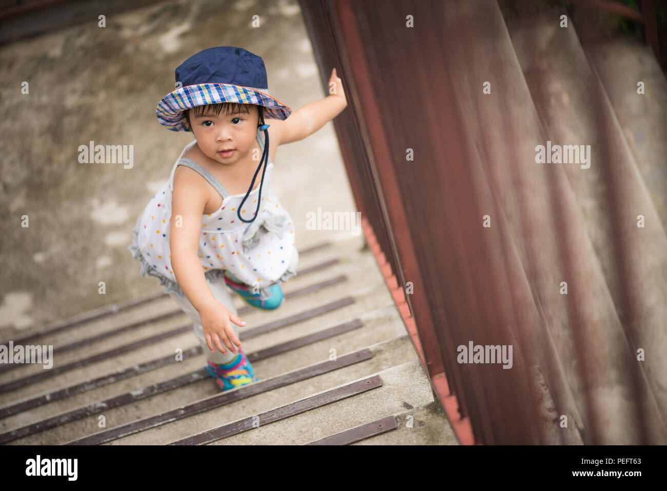 Boy walking up stairs hi-res stock photography and images - Alamy