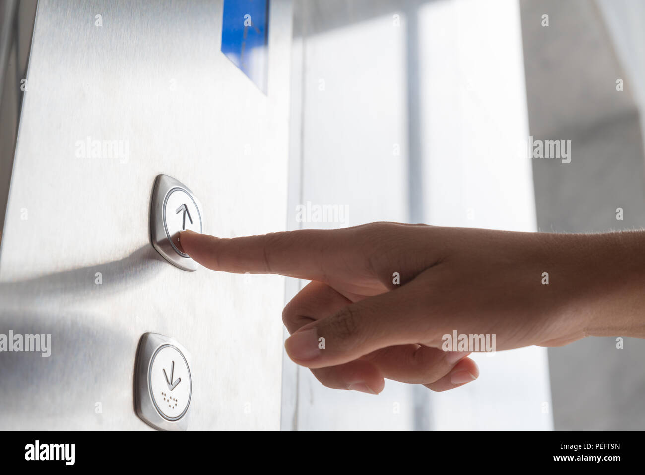 Pushing elevator buttons hi-res stock photography and images - Alamy