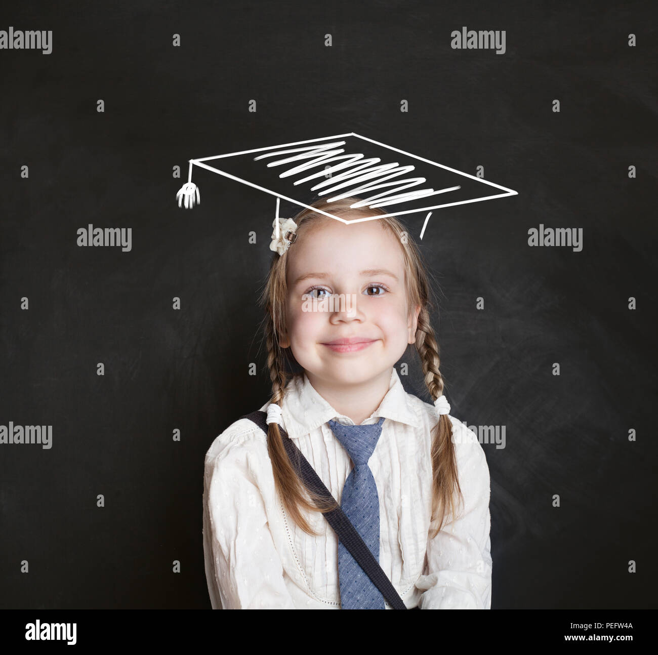 Smart Kid in Graduation Hat on Blackboard Background Stock Photo - Alamy
