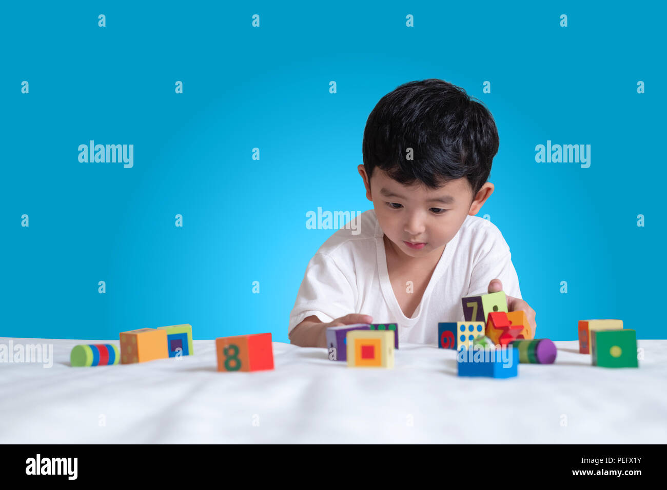 Child playing with shape sorter hi-res stock photography and images - Alamy