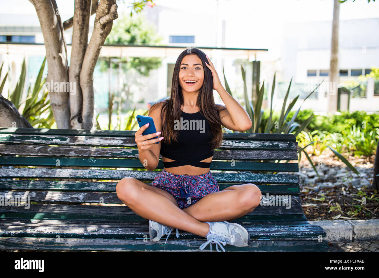 Mexican woman sitting on bench hi-res stock photography and images - Alamy
