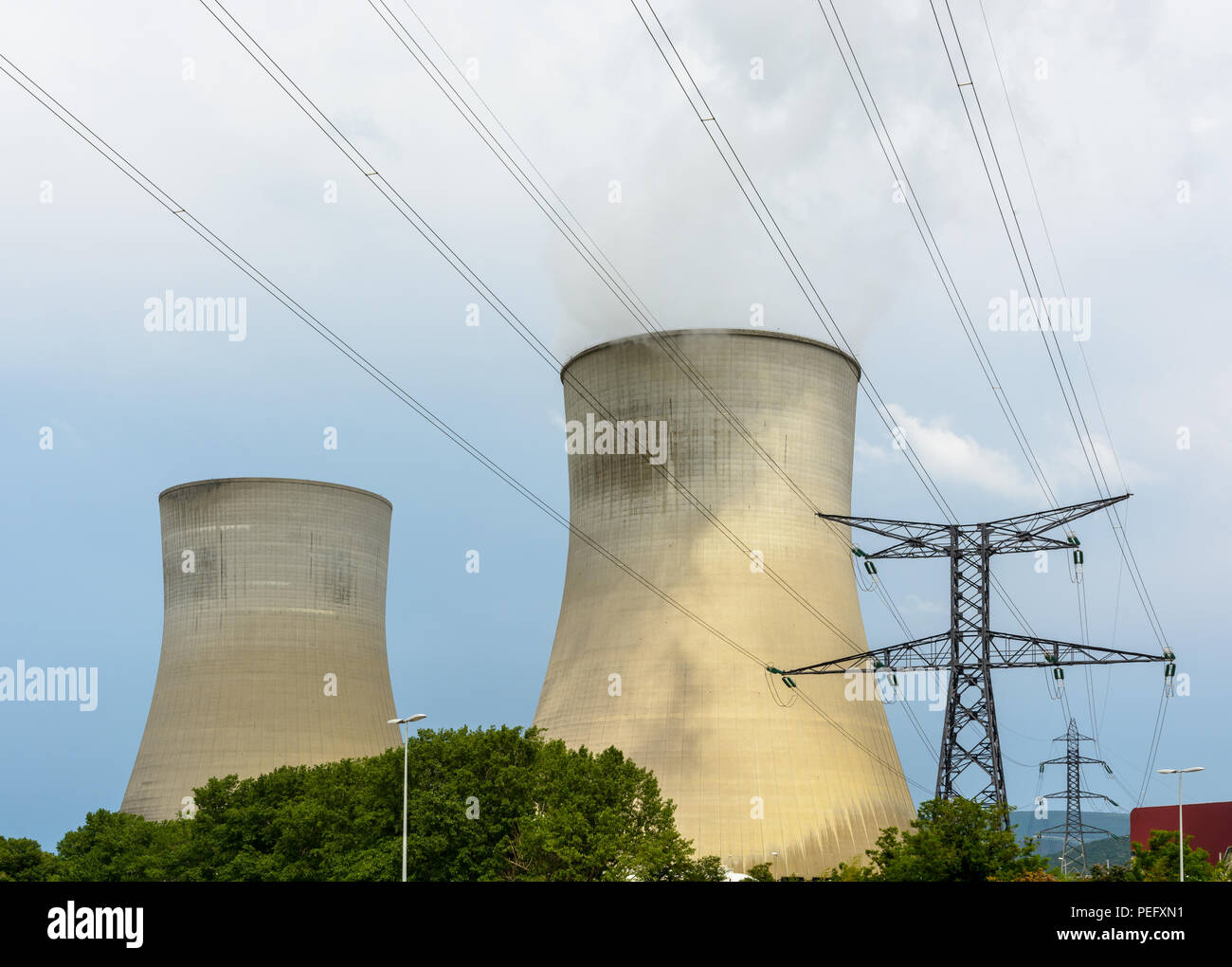 Two cooling towers of a nuclear power plant releasing clouds of water ...