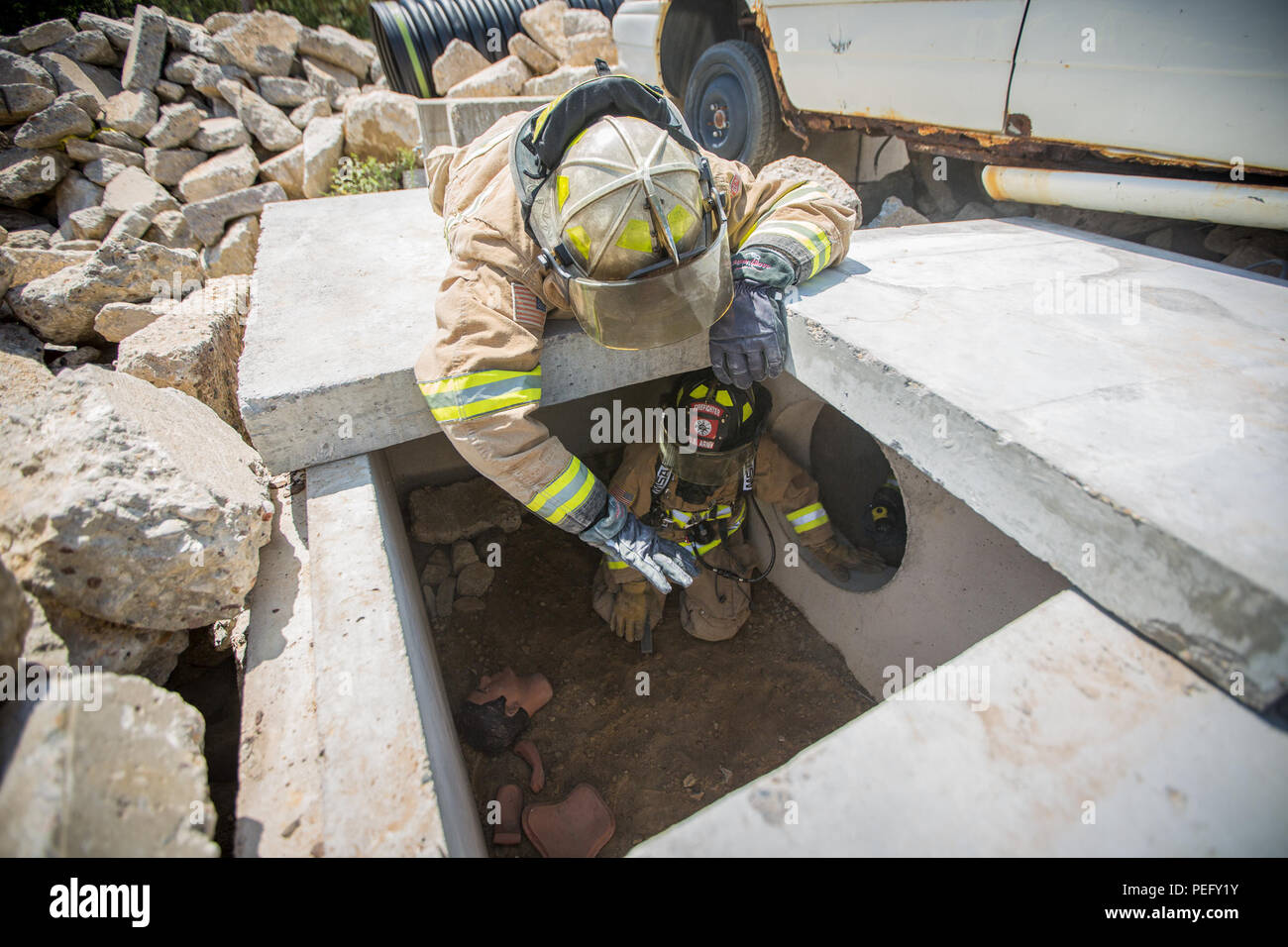 U.S. Army Soldier Sgt. Norman Choy of the 628th Firefighter Detachment ...