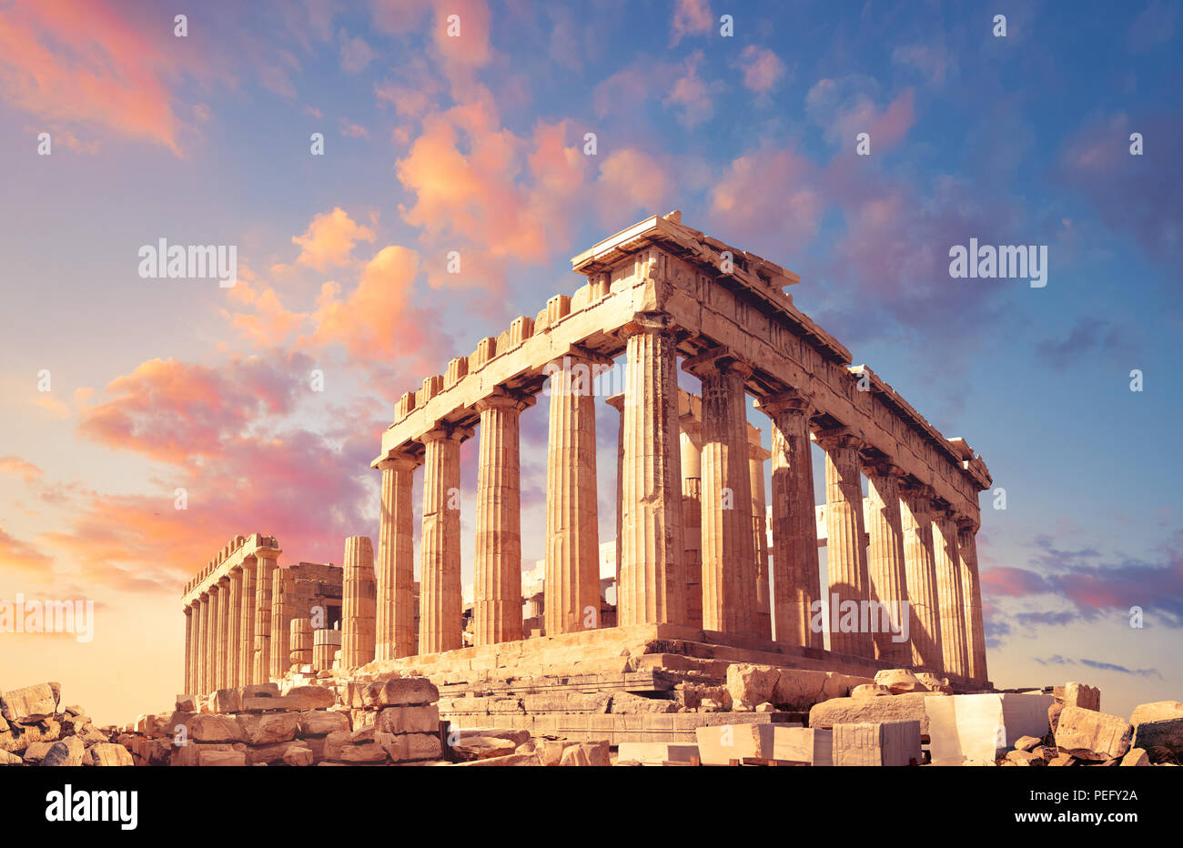 Parthenon temple on a sunset with pink and purple clouds. Acropolis in ...