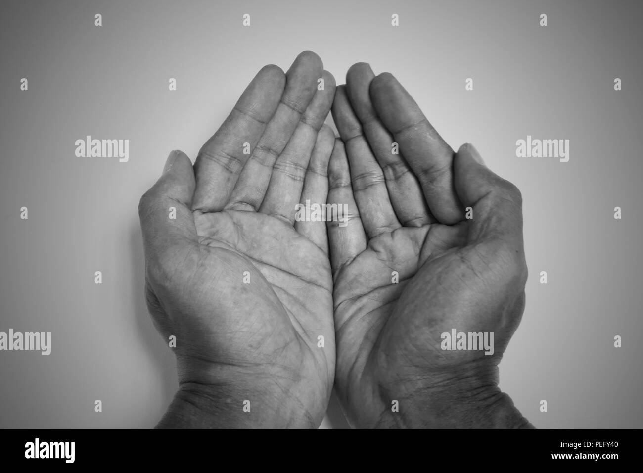 Begging hands hi-res stock photography and images - Alamy