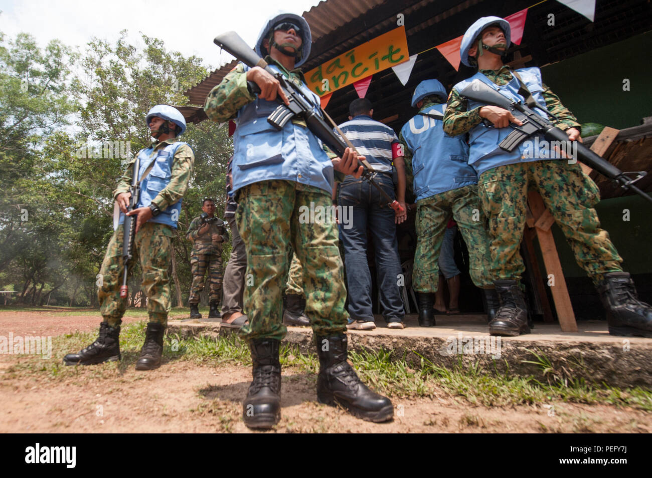 Royal Brunei Armed Forces soldiers provide security around a simulated ...