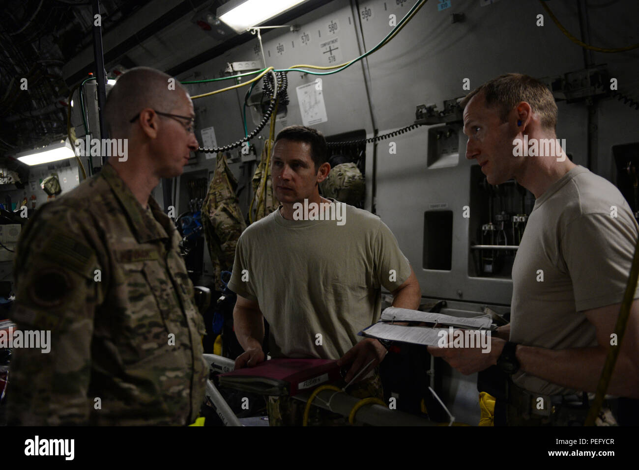 U.S. Air Force Maj. Jonathan Freeman, center, 455th EAES medical crew ...