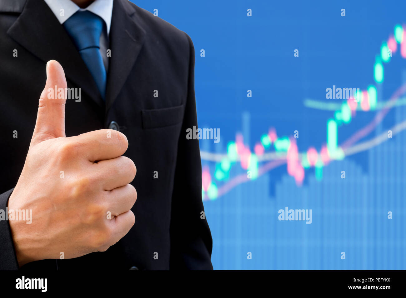 Isolated businessman in dark gray suit raising his thumb up represent ...