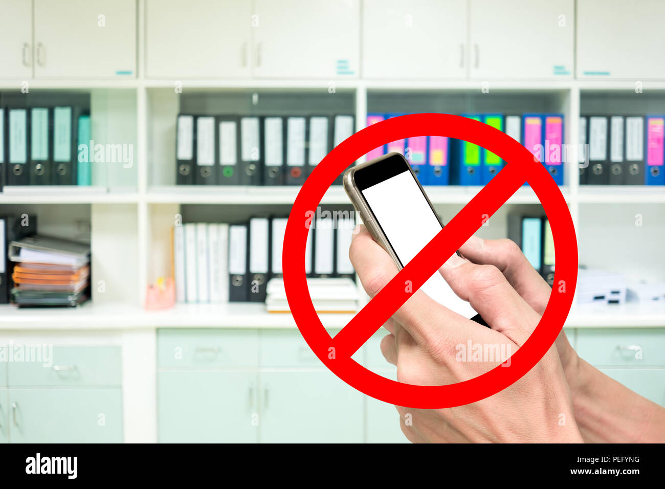 Using and playing phone or smartphone in working office hour is ...