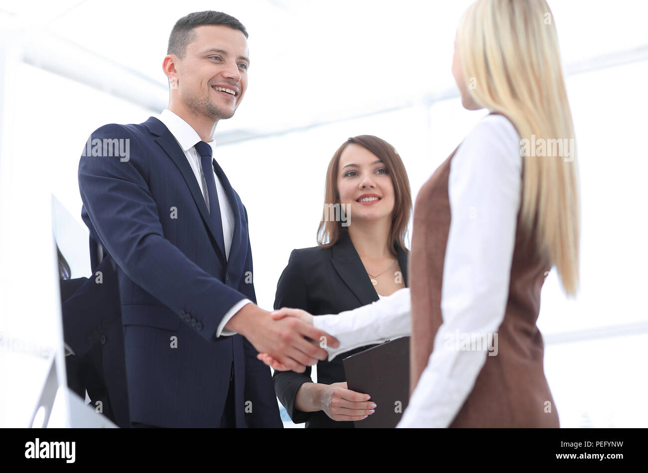 business colleagues shaking hands after a successful presentation Stock ...