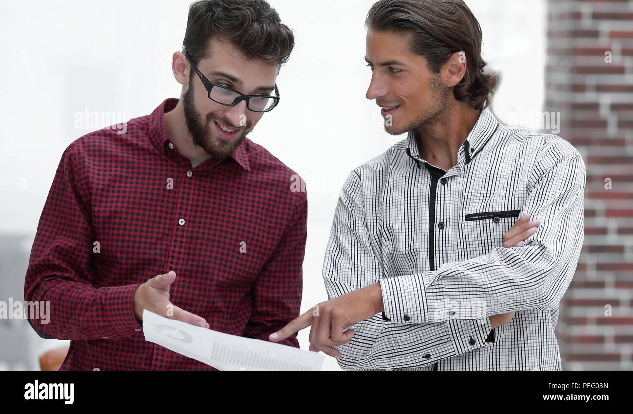 two office employee talking in the office Stock Photo - Alamy