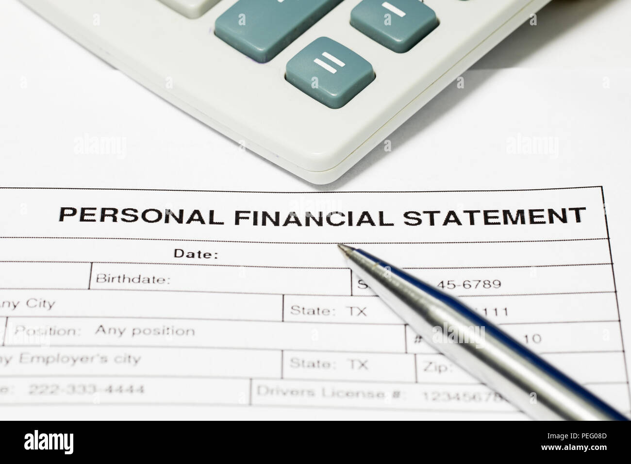 Personal financial statement document, pen and calculator Stock Photo ...