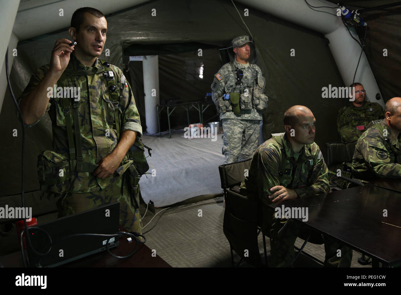 U.S. Army Master Sgt. Scott Smith, center, of Raptor Team, Joint ...