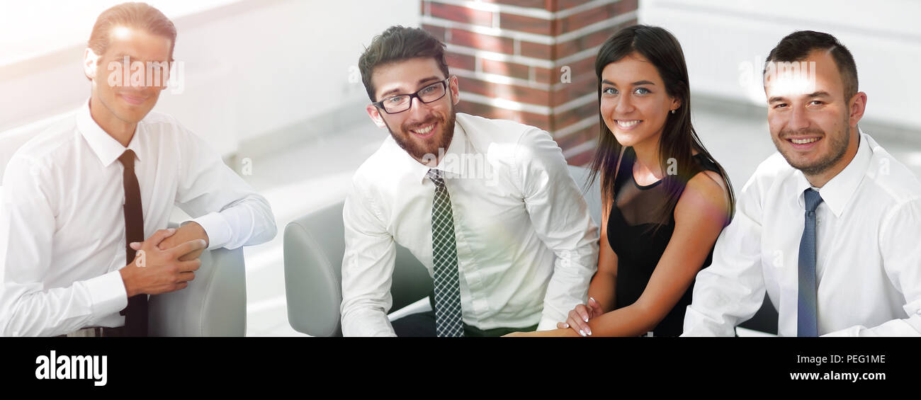 successful business team sitting in office lobby Stock Photo - Alamy