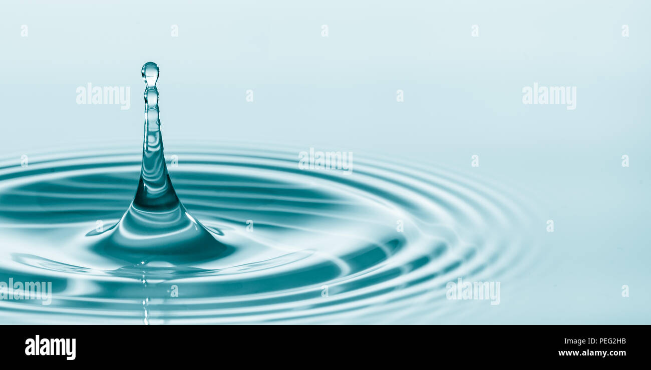 Water drop falling into water making a perfect droplet splash Stock Photo - Alamy