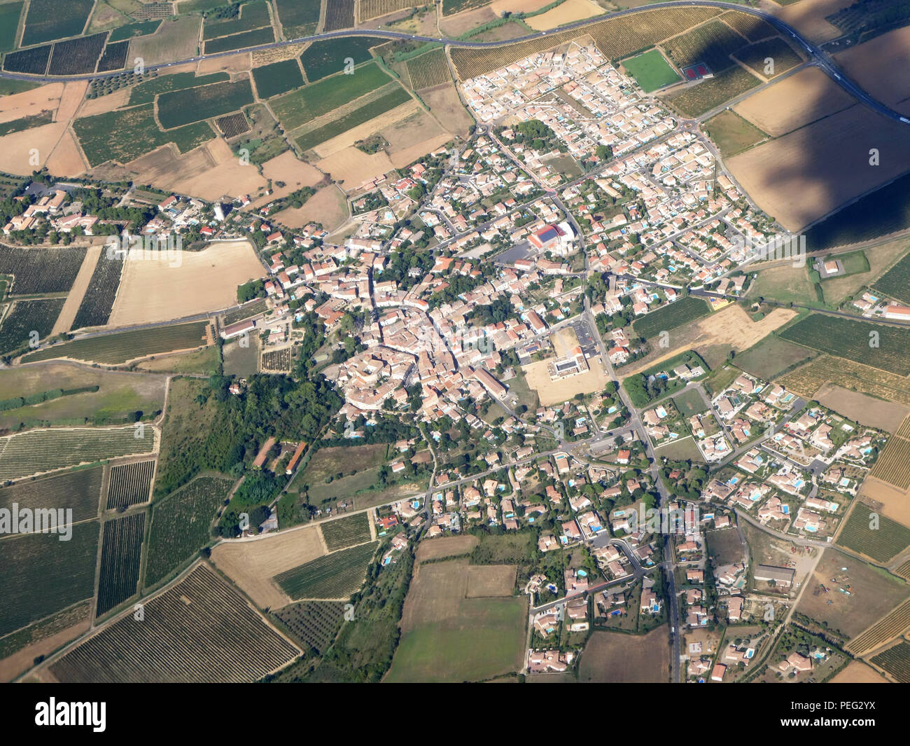 Aerial photograph of Puimisson, France one of the many small villages ...
