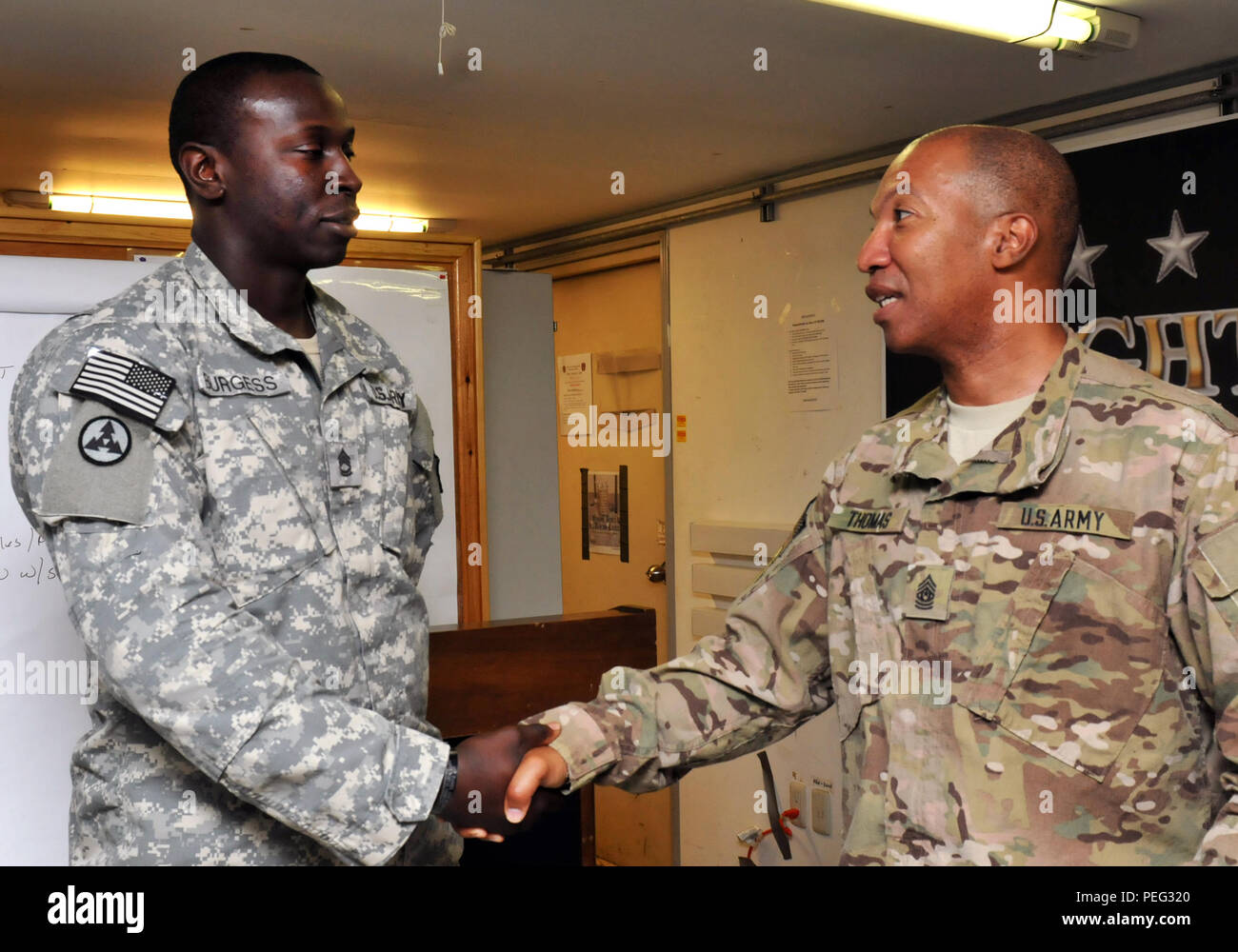 Command Sgt. Maj. Luther Thomas Jr. (right) awards Sgt. 1st Class ...
