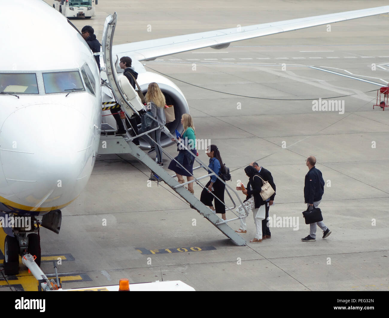Passengers Boarding Plane Queue High Resolution Stock Photography and ...