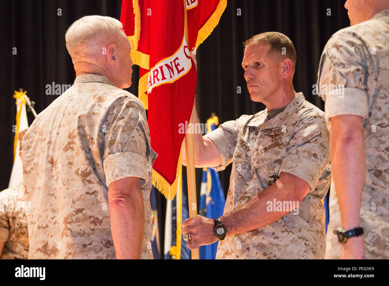 Lt. Gen. Robert S. Walsh, right, receives the unit's flag from Lt. Gen ...
