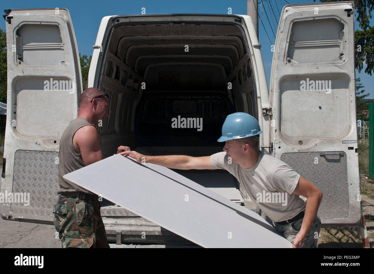 U.S. Army Reserve Pfc. Jared Poulson (right), construction engineer ...