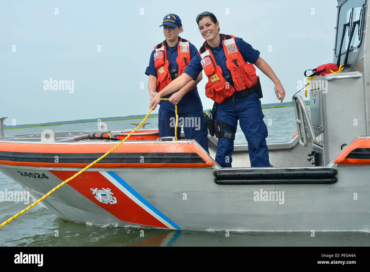 Petty Officer 3rd Class Madeline Sorrentino (right), a boat operator at ...
