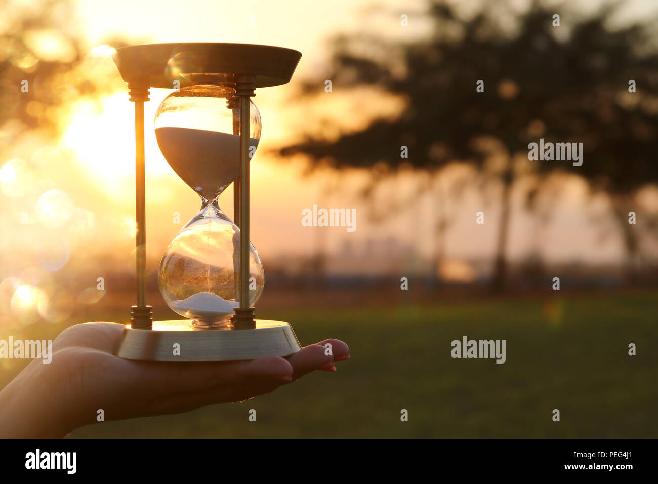 Hourglass at sunset hi-res stock photography and images - Alamy
