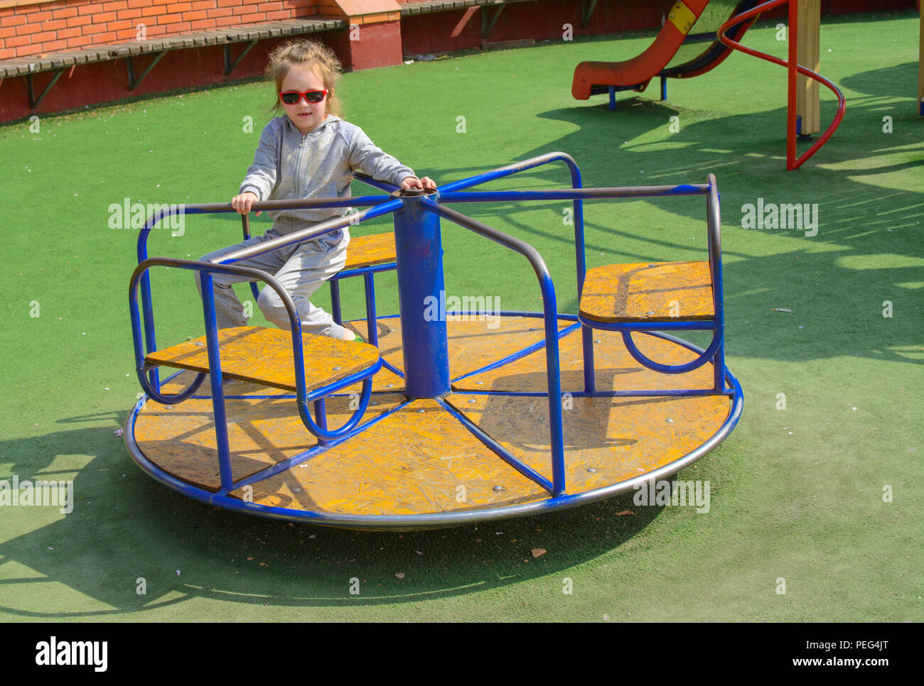 Little children run around and play in the playground. Game center for ...