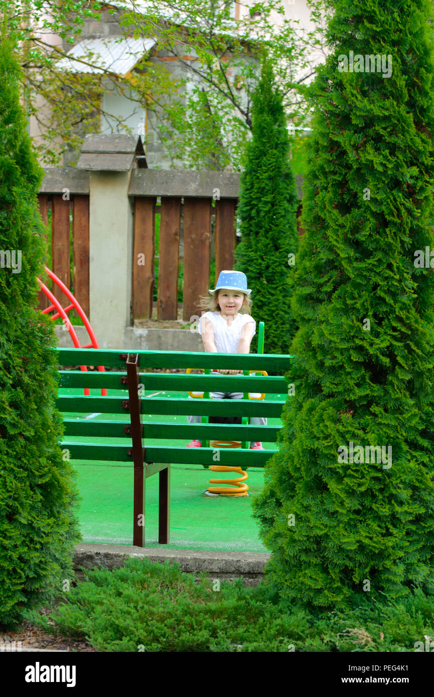 Little children run around and play in the playground. Game center for ...