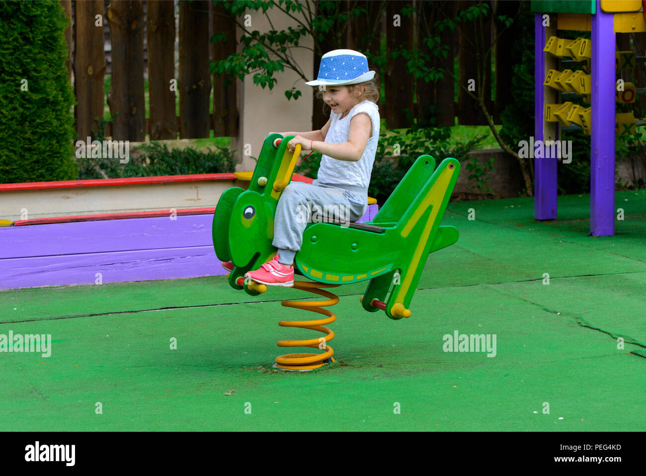 Little children run around and play in the playground. Game center for ...