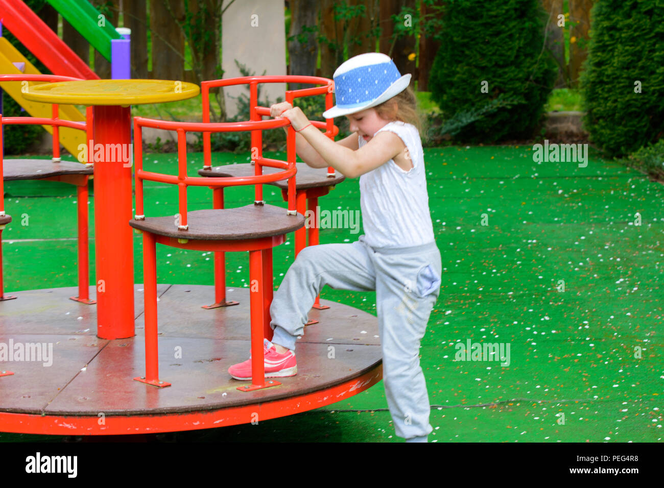 Little children run around and play in the playground. Game center for ...