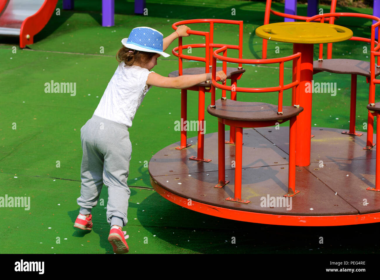 Little children run around and play in the playground. Game center for ...