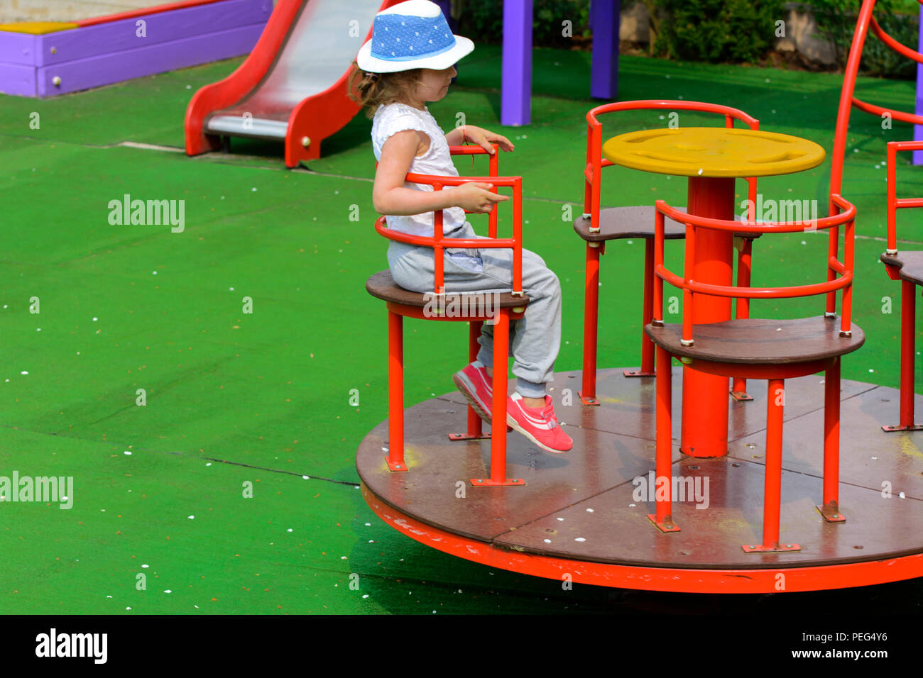 Little children run around and play in the playground. Game center for ...