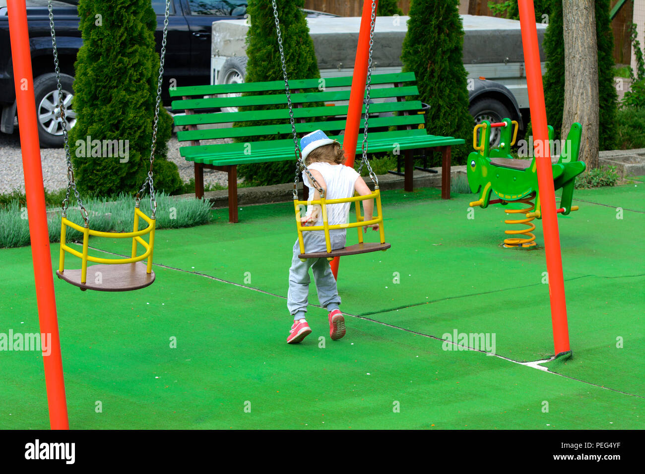 Little children run around and play in the playground. Game center for ...