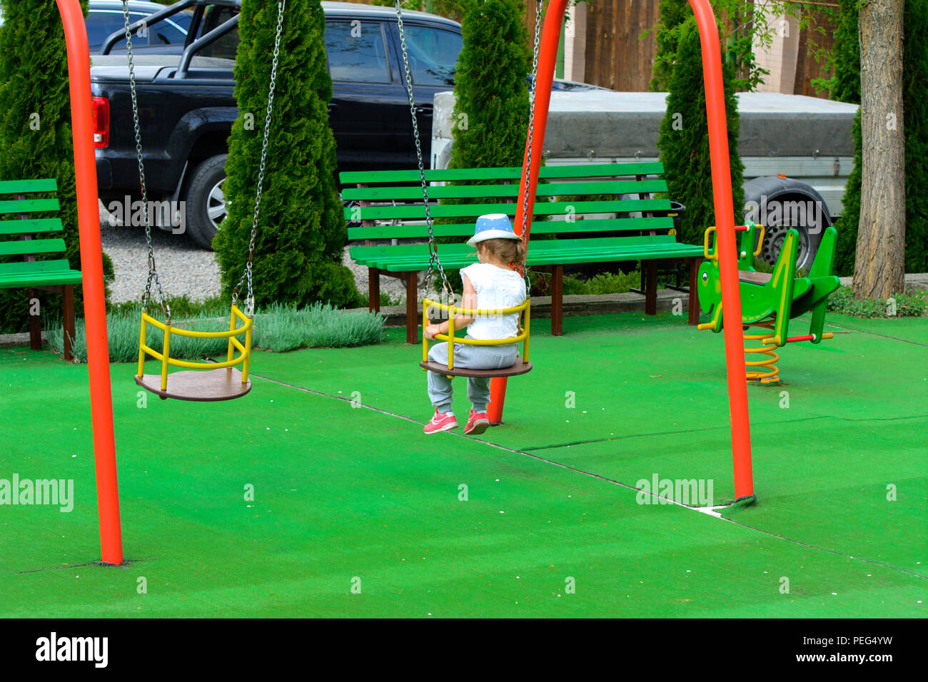 Little children run around and play in the playground. Game center for ...