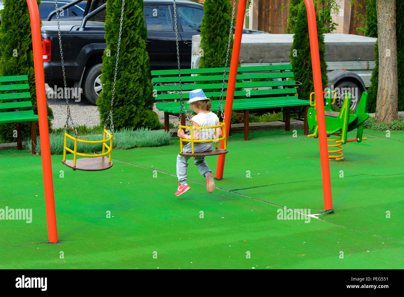 Little children run around and play in the playground. Game center for ...