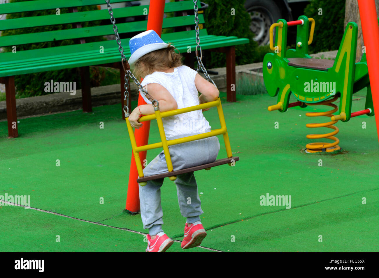 Little children run around and play in the playground. Game center for ...