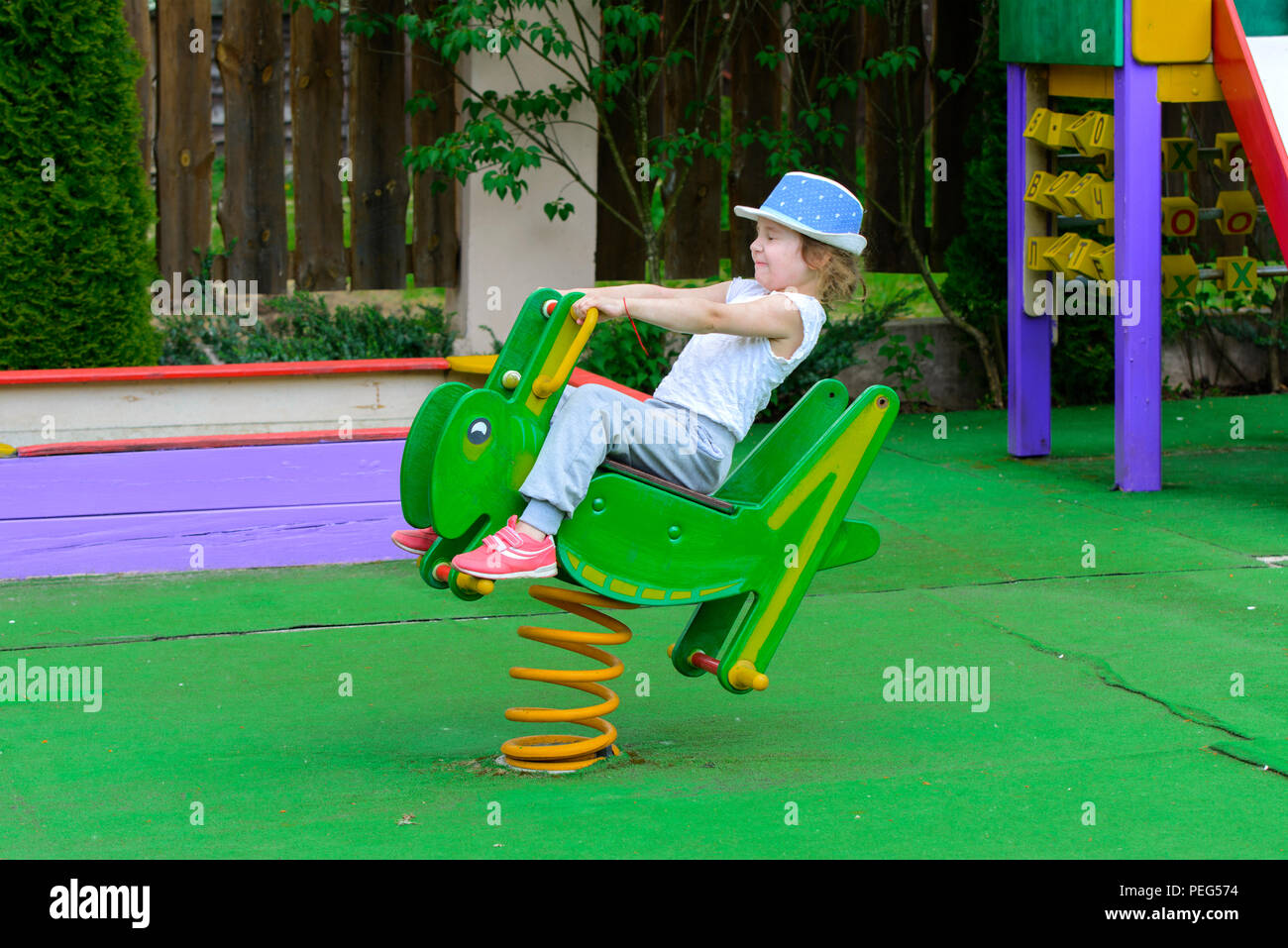 Little children run around and play in the playground. Game center for ...