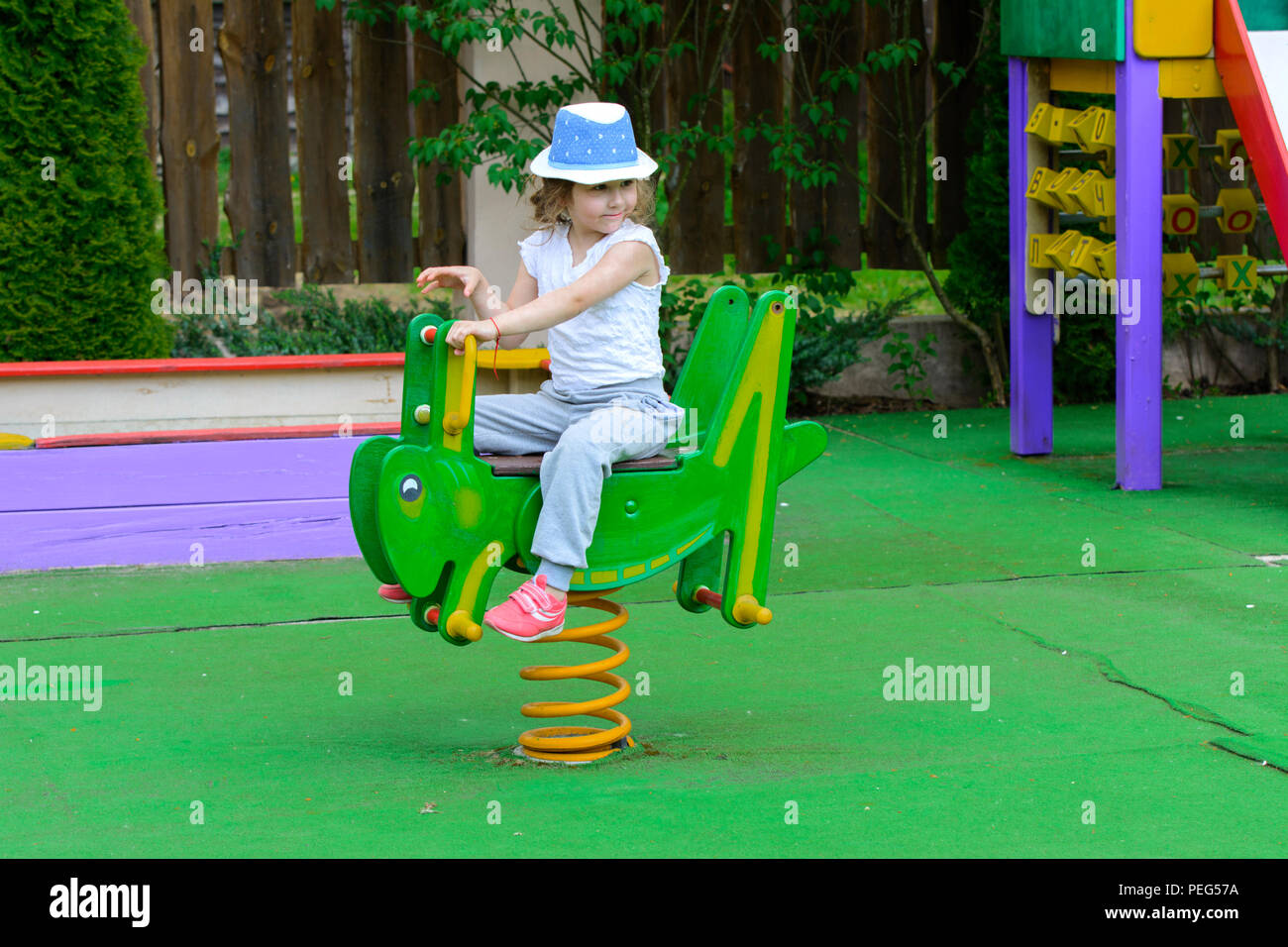 Little children run around and play in the playground. Game center for ...