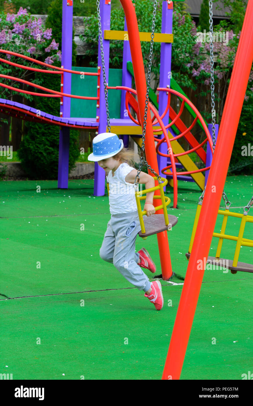 Little children run around and play in the playground. Game center for ...