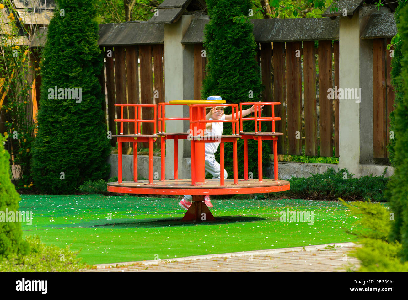 Little children run around and play in the playground. Game center for ...