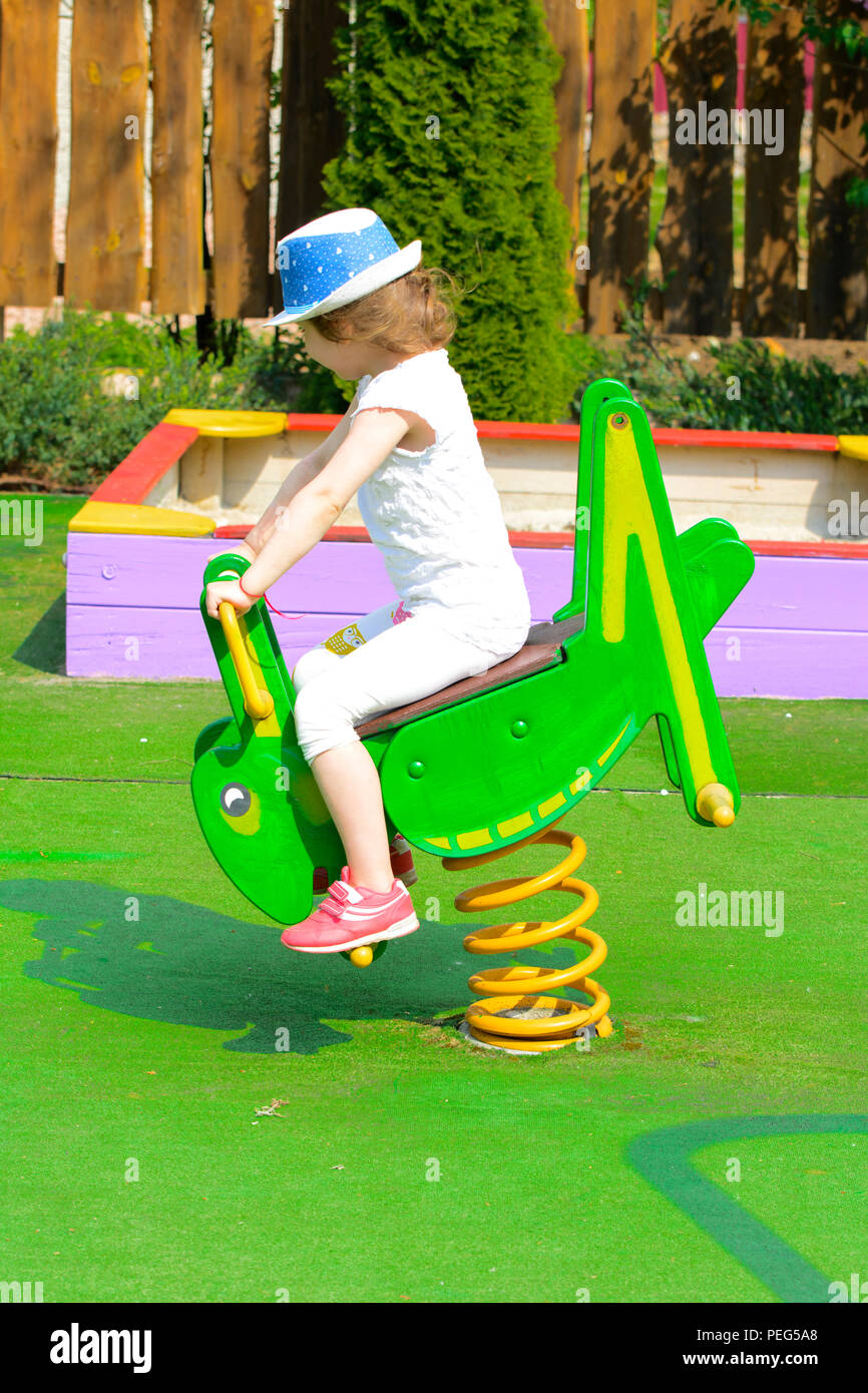 Little children run around and play in the playground. Game center for ...