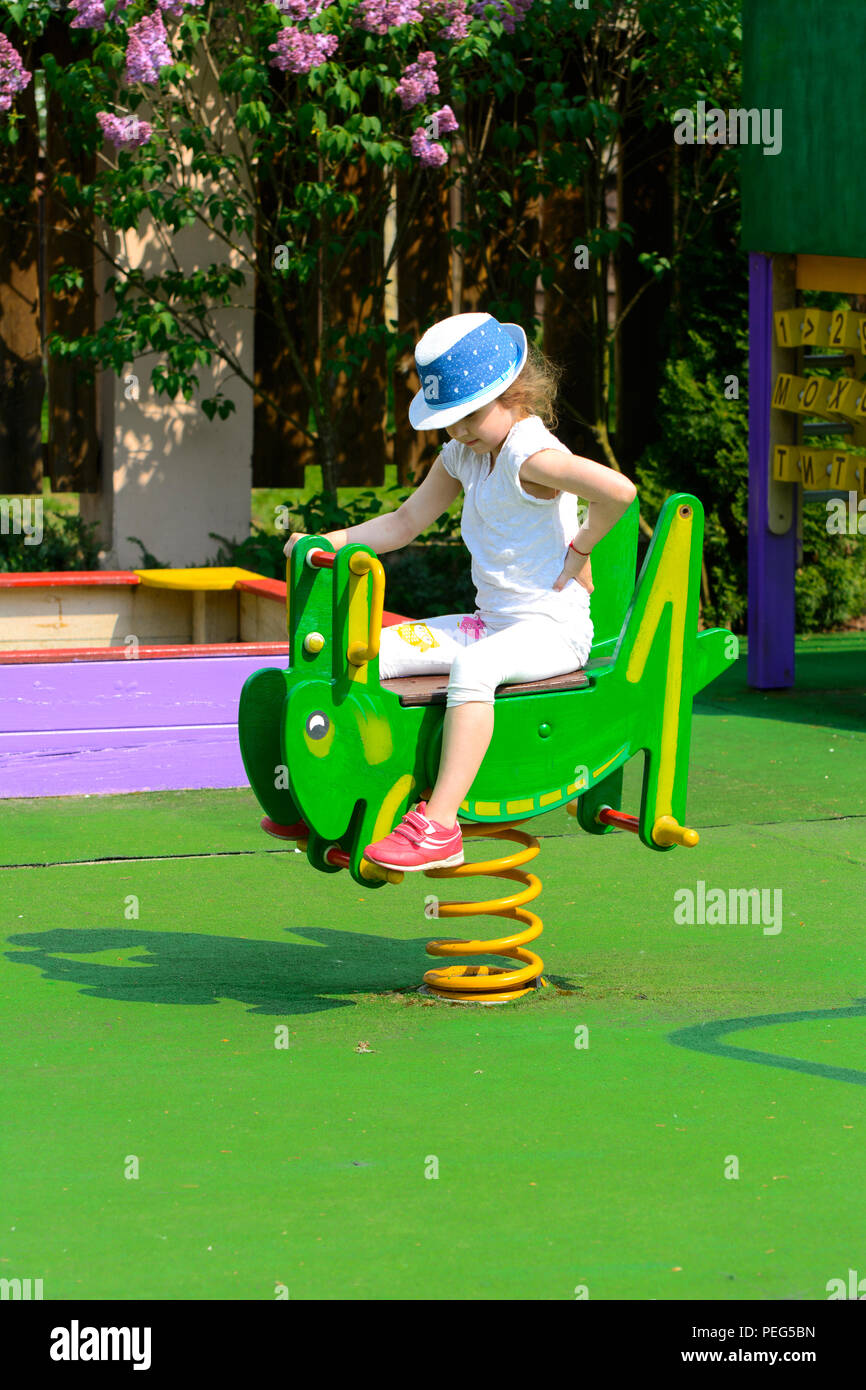 Little children run around and play in the playground. Game center for ...