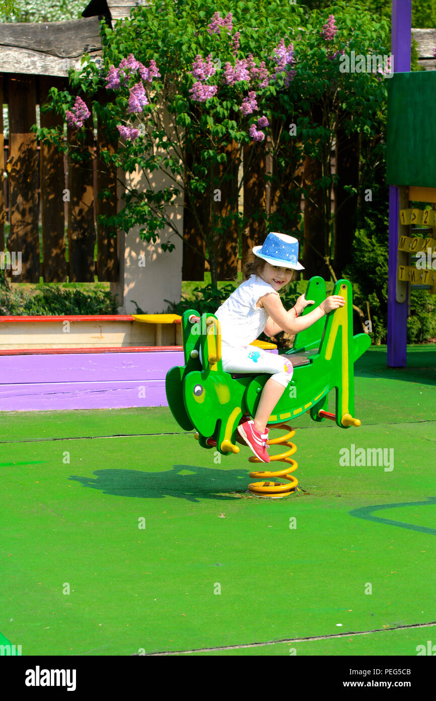 Little children run around and play in the playground. Game center for ...