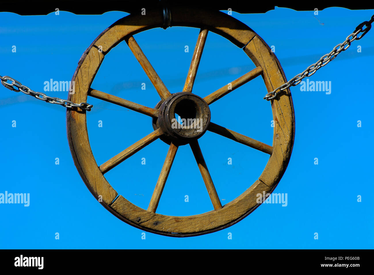 Wheel of the past. An antique old wooden wheel from a rural cart ...