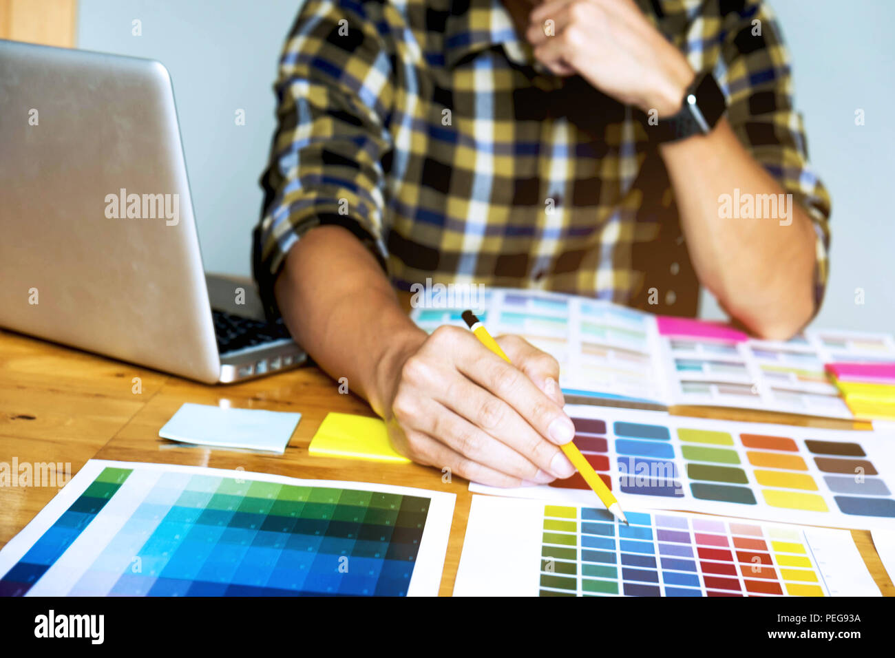 Graphic designers choose colors from the color bands samples for design ...