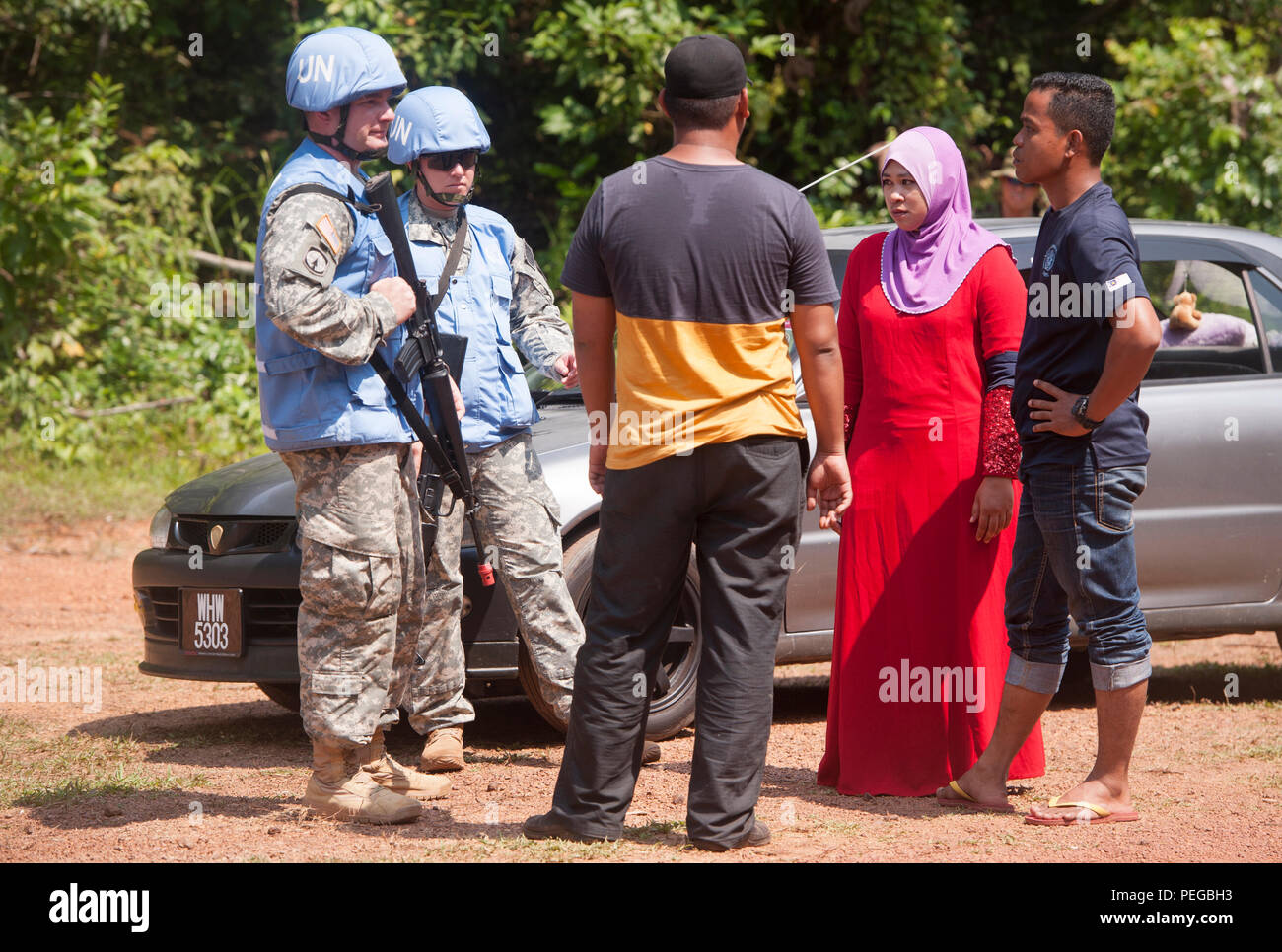U.S. Army Sgt. Logan Lehman, left, and Spc. McKenna Harris, right, both ...