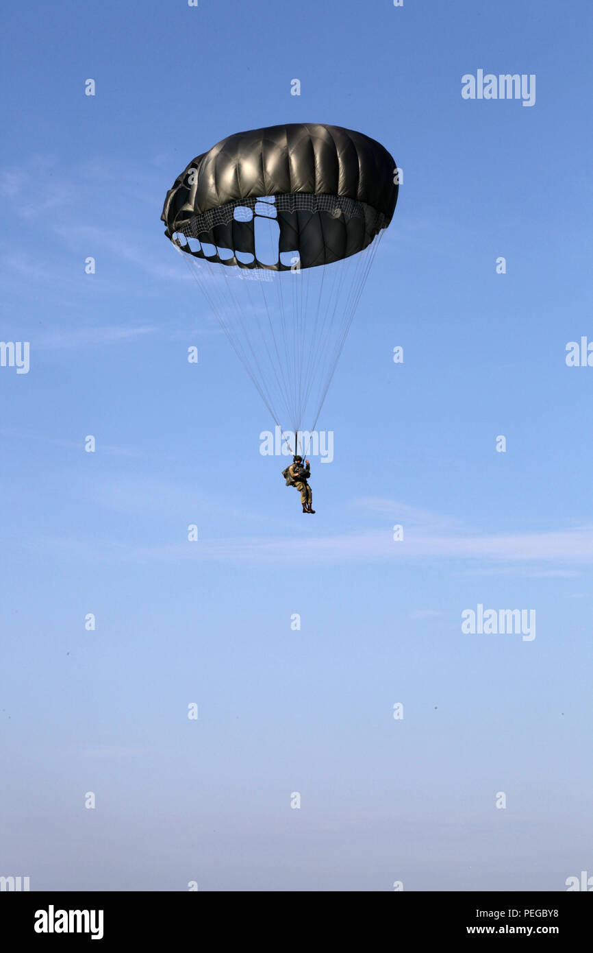 A re-enacter and member of the Liberty Jump Team descends onto a drop ...