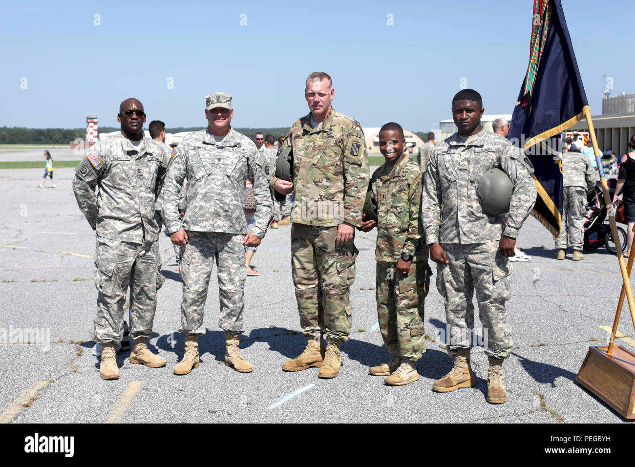 U.S. Army service members pose for a photo following a jump and the ...