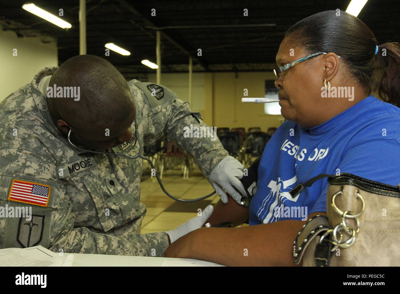 Spc. Quentin Moore, a health care specialist assigned to the 7233rd ...