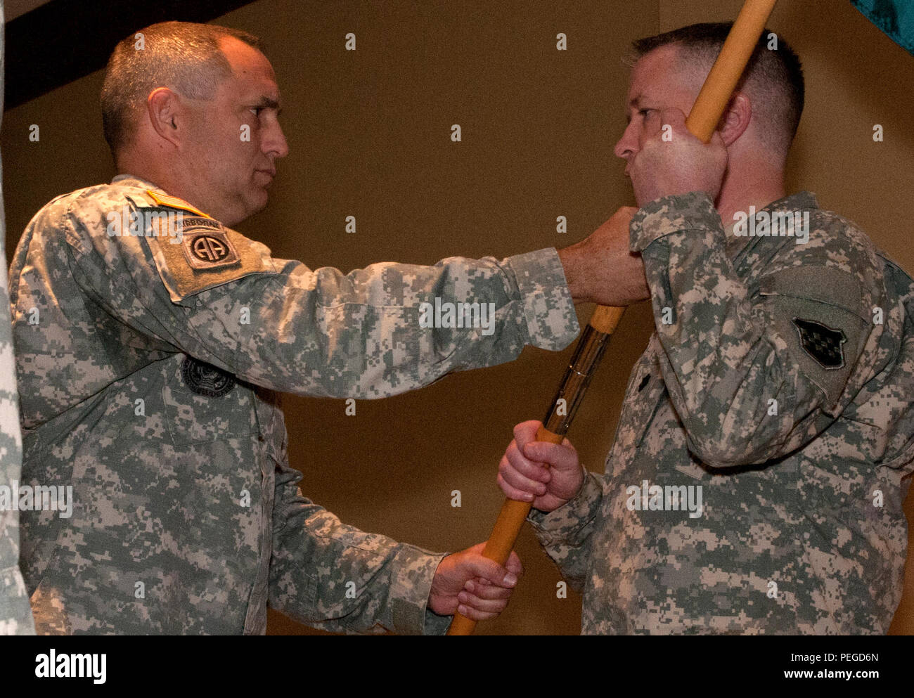 Command Sgt. Maj. Chris Luchsinger hands the 314th Press Camp ...